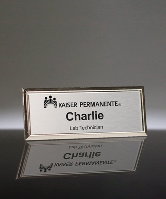 Imprinted Metal Name Badge With Silver Frame - 3 x 1 Inch | Edco Awards